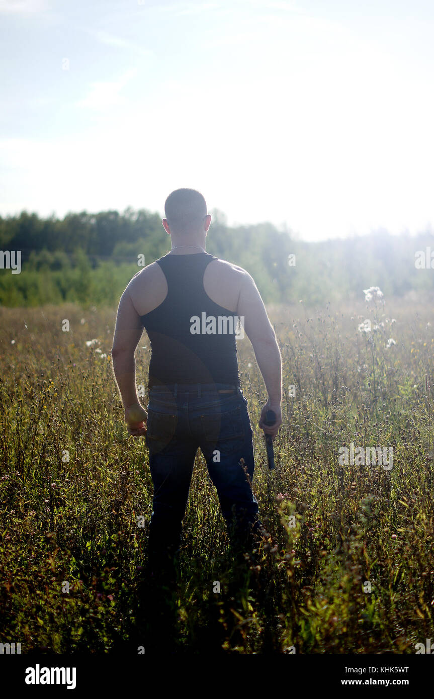 Back view man gun hi-res stock photography and images - Alamy