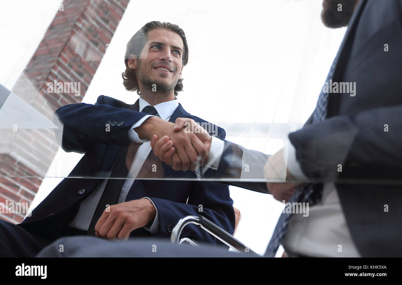 bottom view. confident handshake of business partners Stock Photo - Alamy