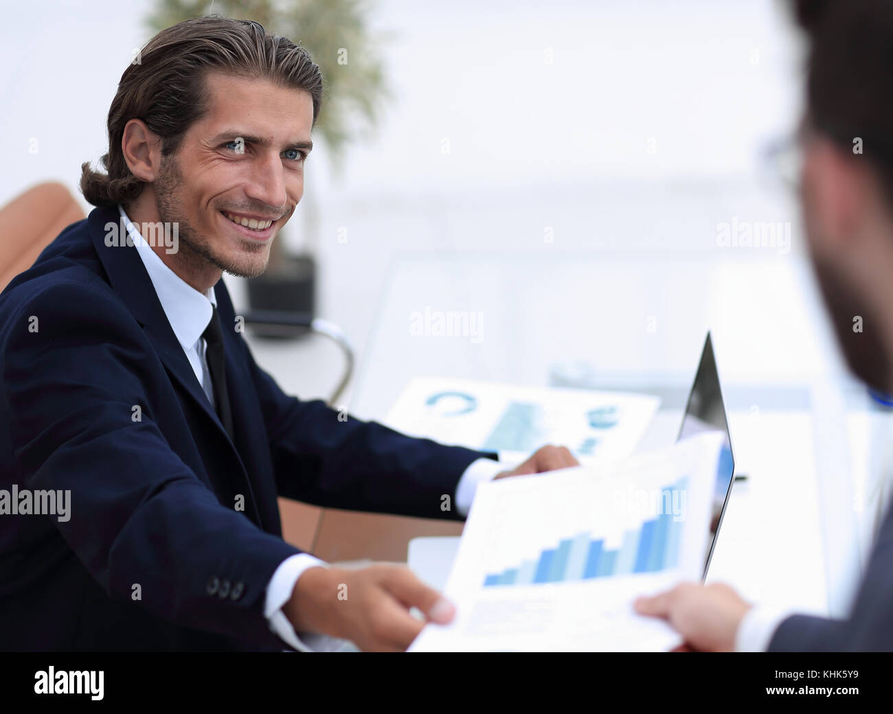 employee gives the Manager the financial report Stock Photo - Alamy