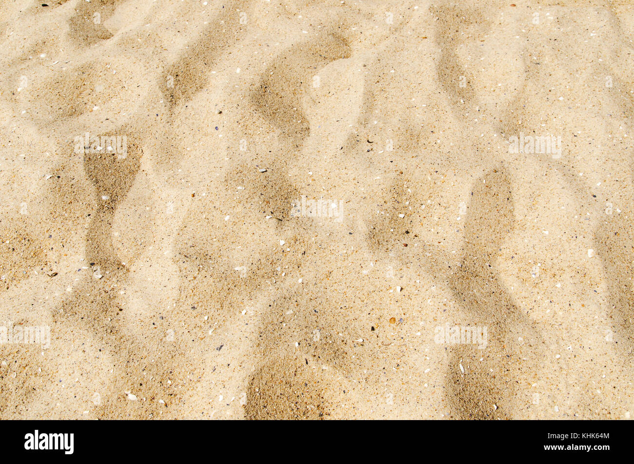 yellow sand on beach as background Stock Photo - Alamy
