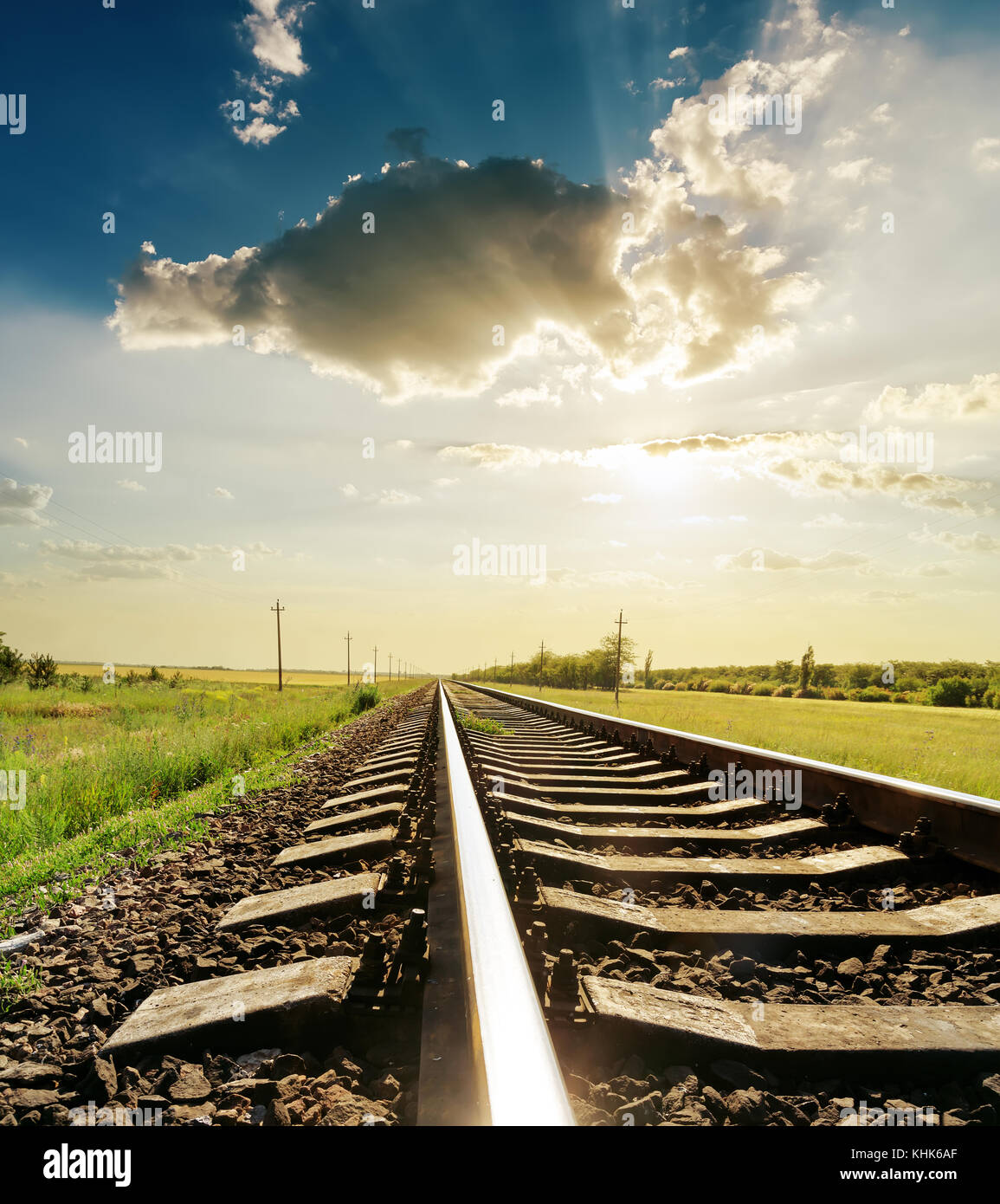 railroad closeup with reflections under sunset Stock Photo - Alamy