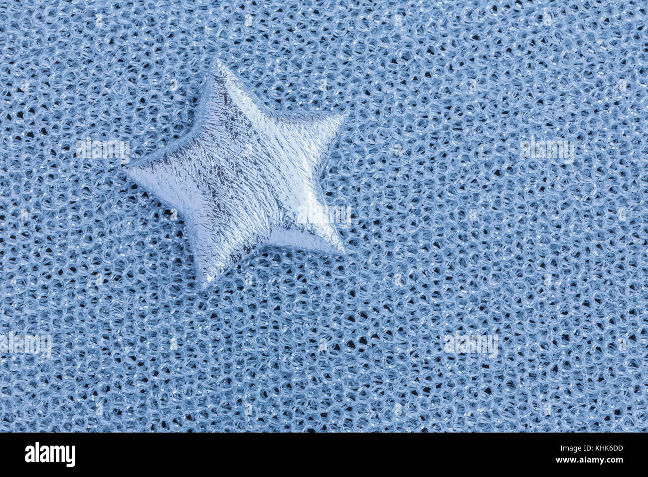 Shiny silver star on gray texture cloth Stock Photo - Alamy