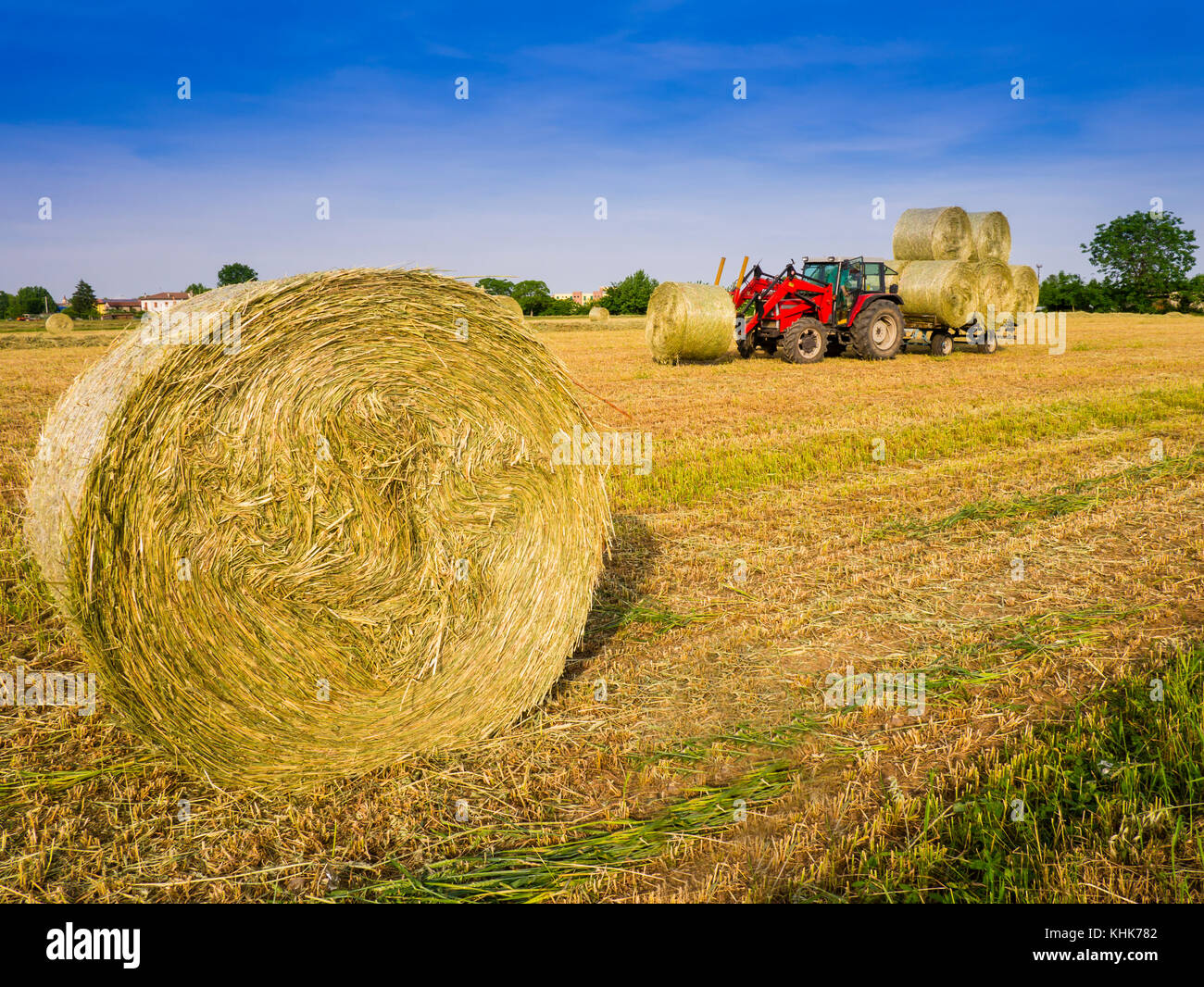 Tractor harvesting hay in hi-res stock photography and images - Alamy