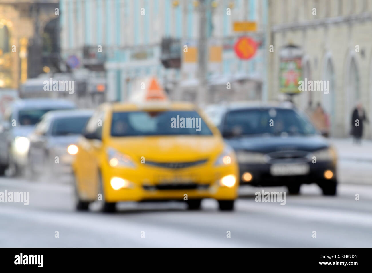 On a city street among transport seen moving taxi Stock Photo - Alamy