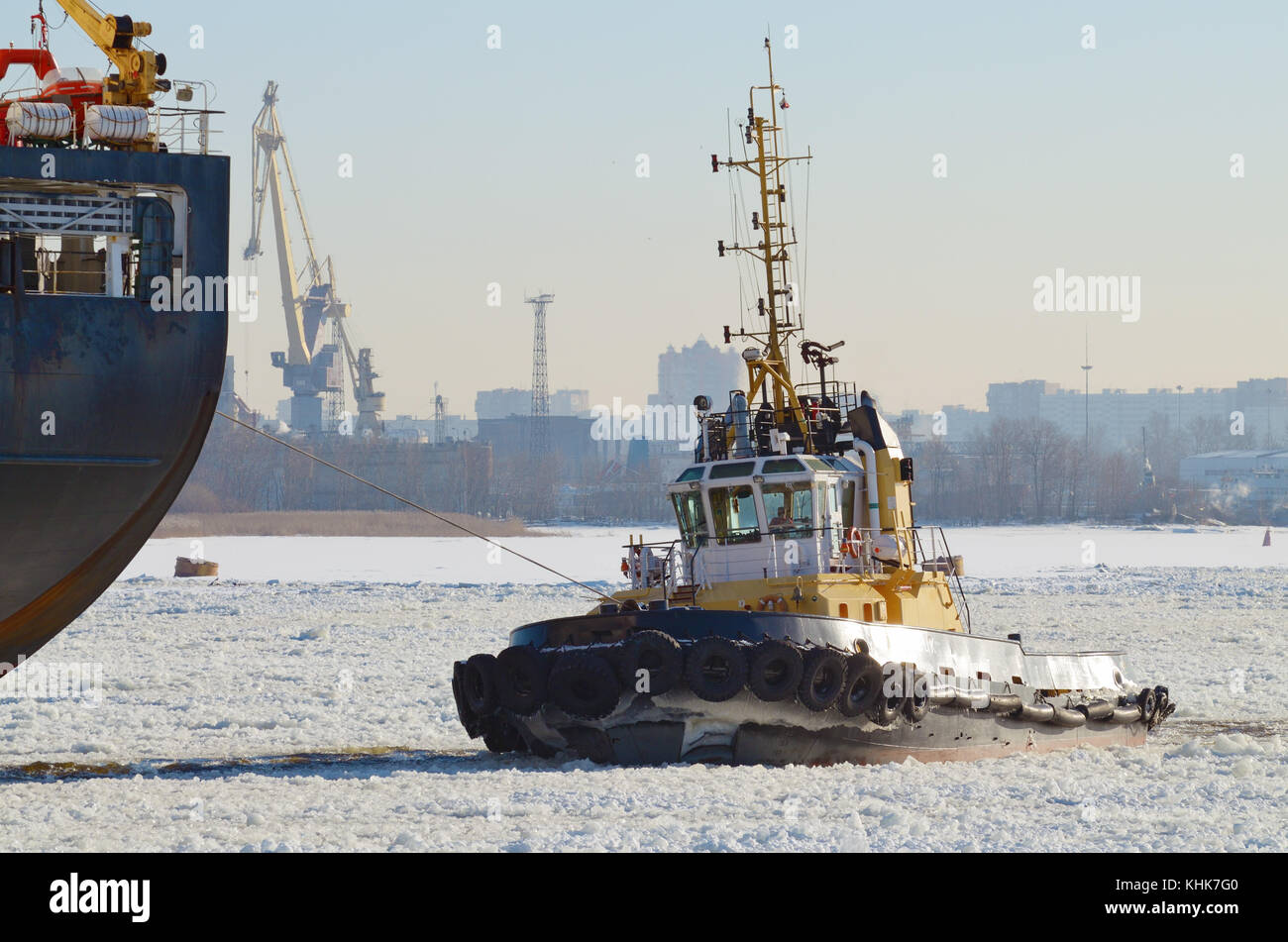 the boat pulling the tanker to the place of loading in the port Stock ...