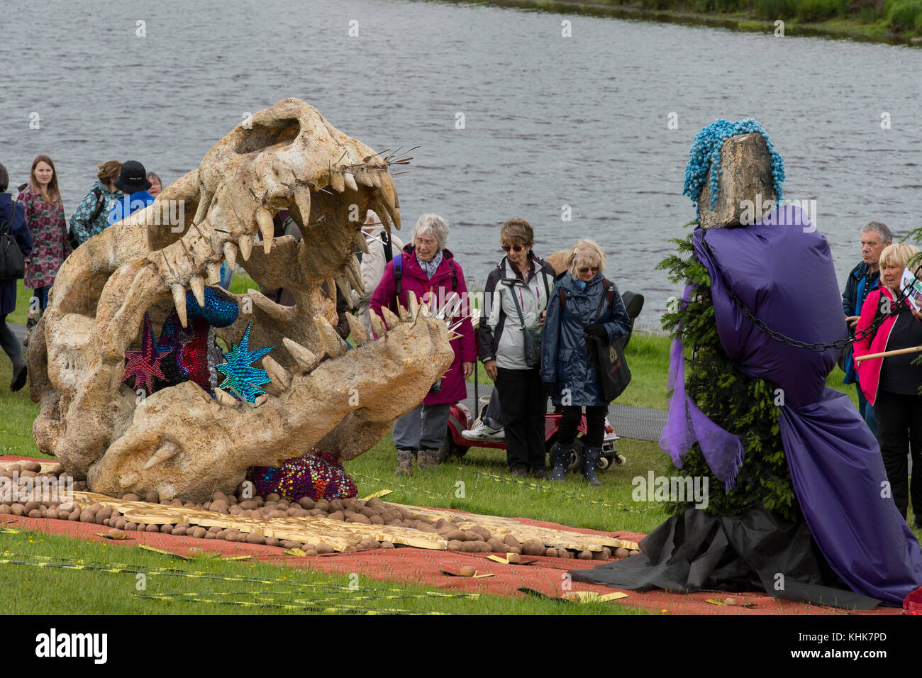 People stand & view theatrical, symbolic & surreal Pic 'n' Mix show ...