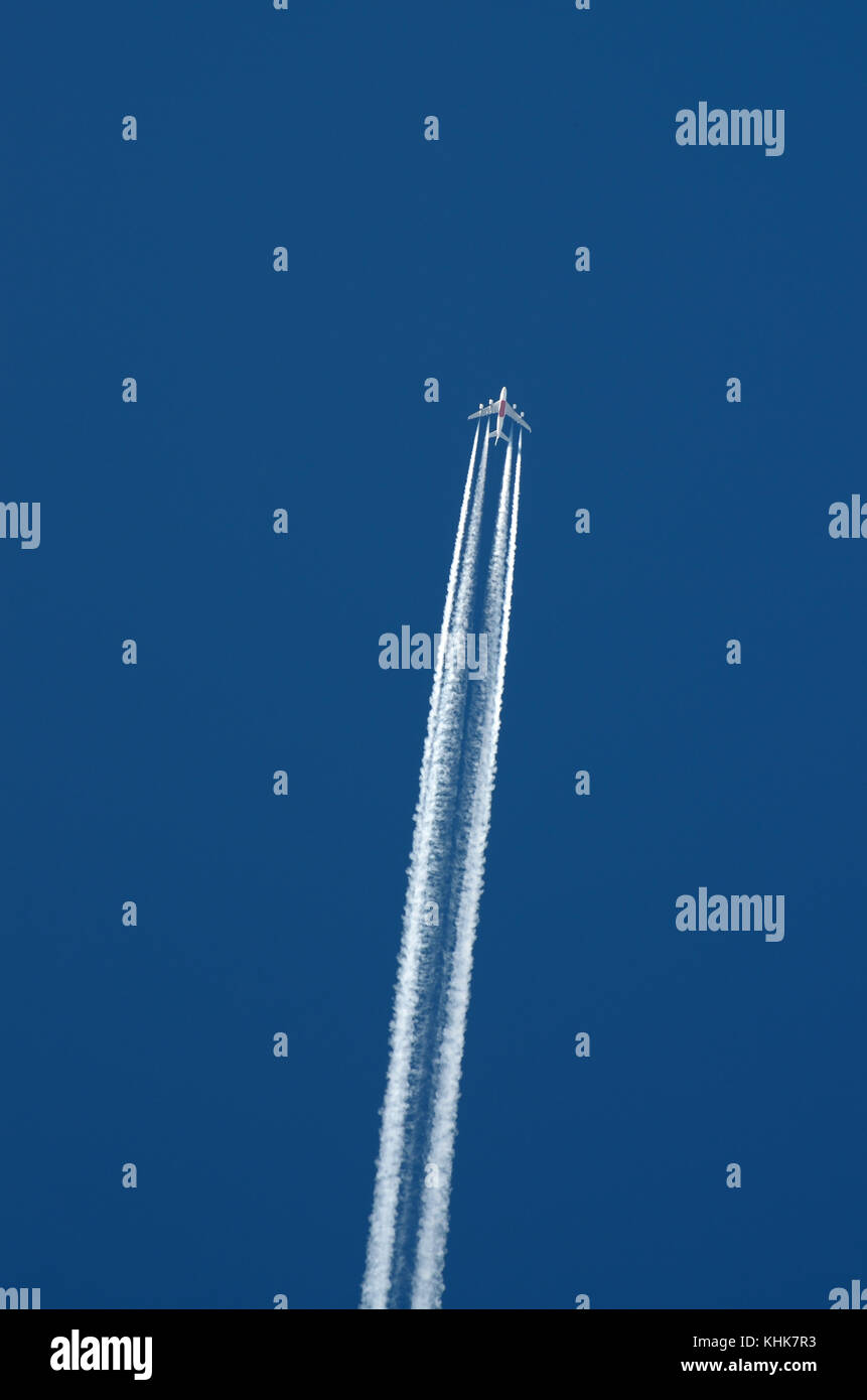 the aircraft is in high speed flying in the sky,leaving a trail Stock ...