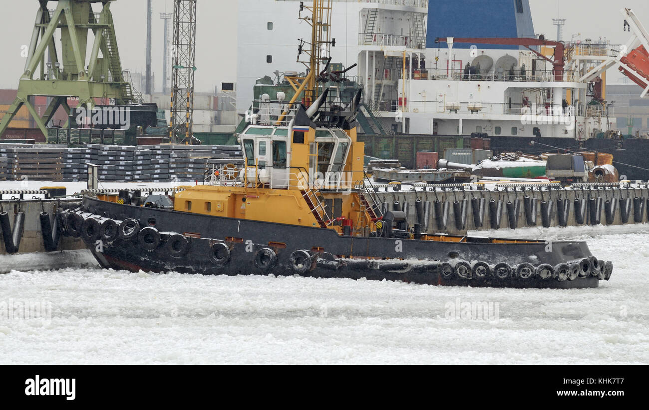 The territory of the port.Working boat floats on the sea Stock Photo ...
