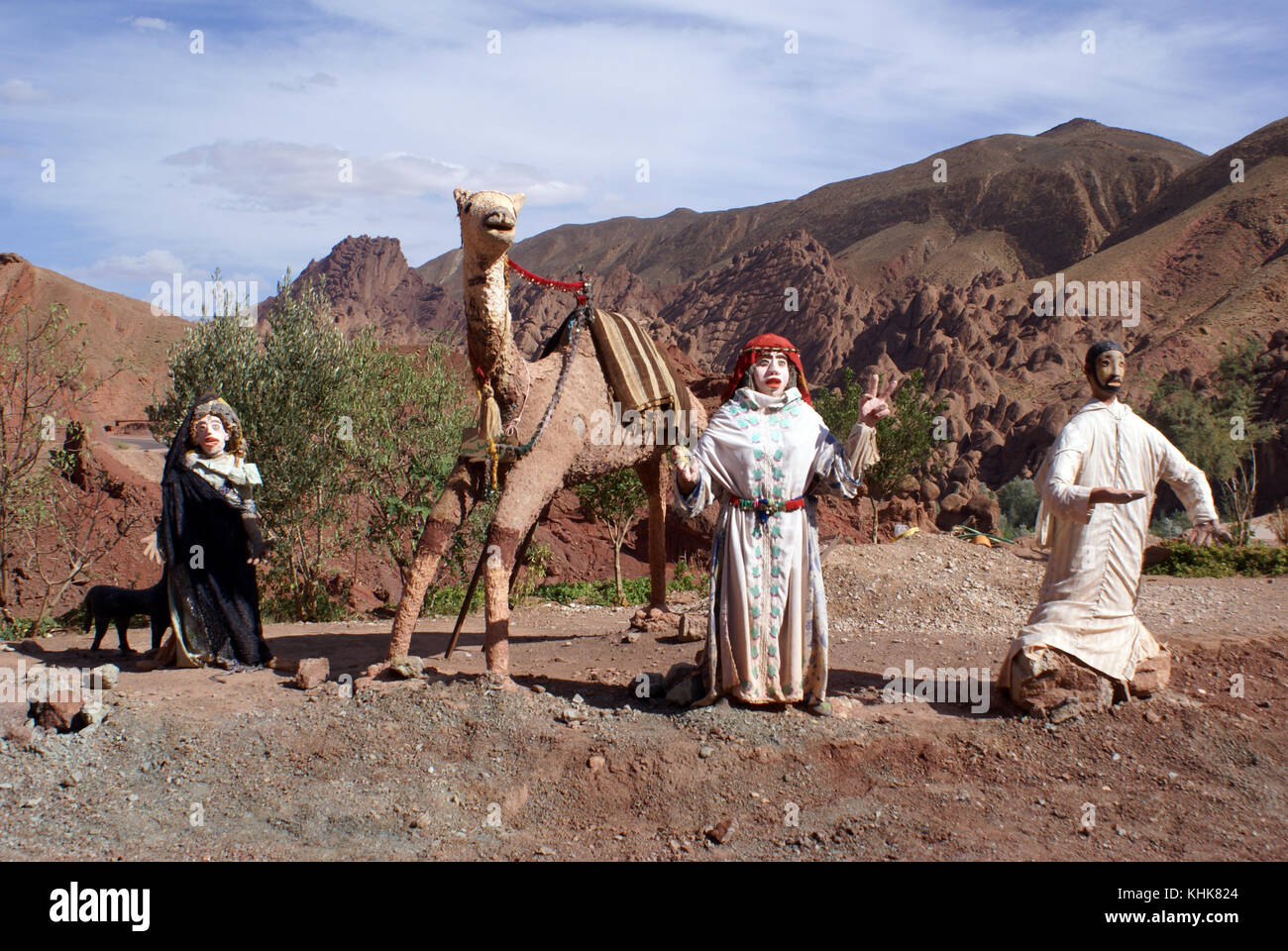 Statues of berber man and woman near the road in Morocco Stock Photo ...