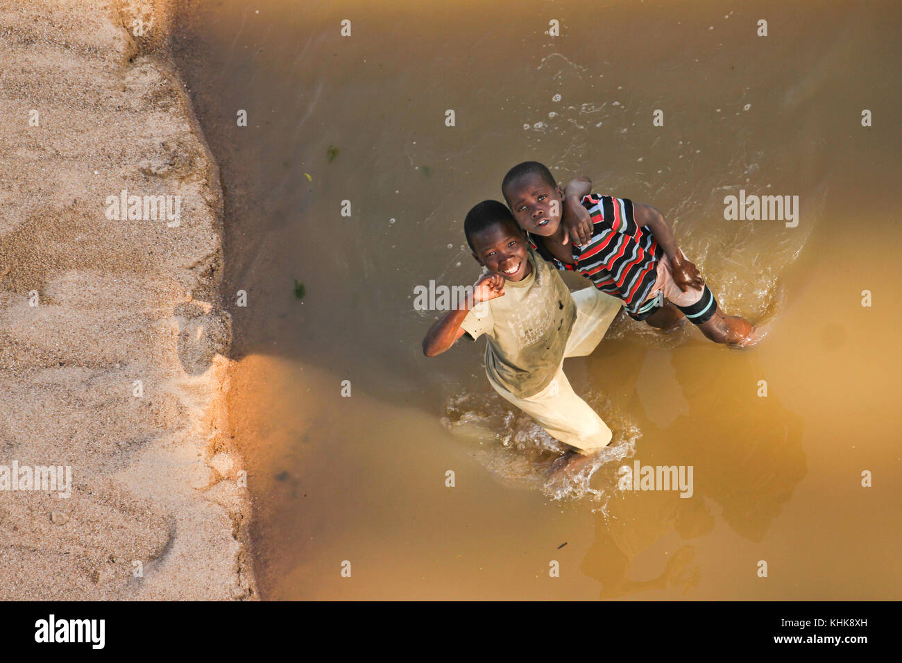 BRICHENOUGH BRIDGE, ZIMBABWE - 15 October 2011. Two boys seen on the ...