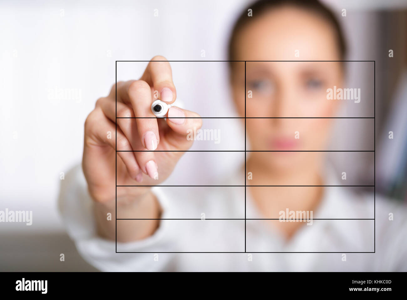 hand of woman writing List on screen Stock Photo - Alamy