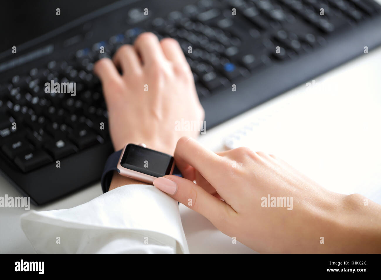 woman using smartwatch and working Stock Photo - Alamy