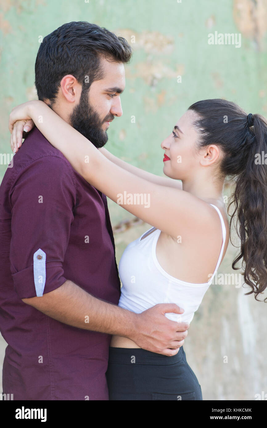 Young Middle Eastern couple hugging outdoors Stock Photo - Alamy