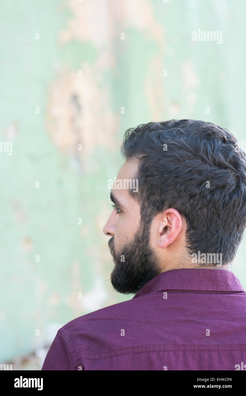 Rear view of a bearded Middle Eastern man looking away outdoors Stock ...