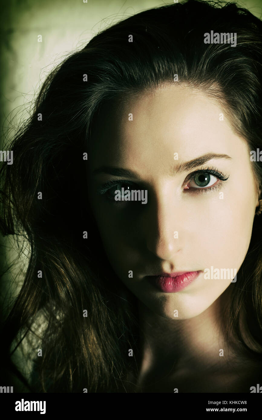 Serious young woman staring Stock Photo - Alamy