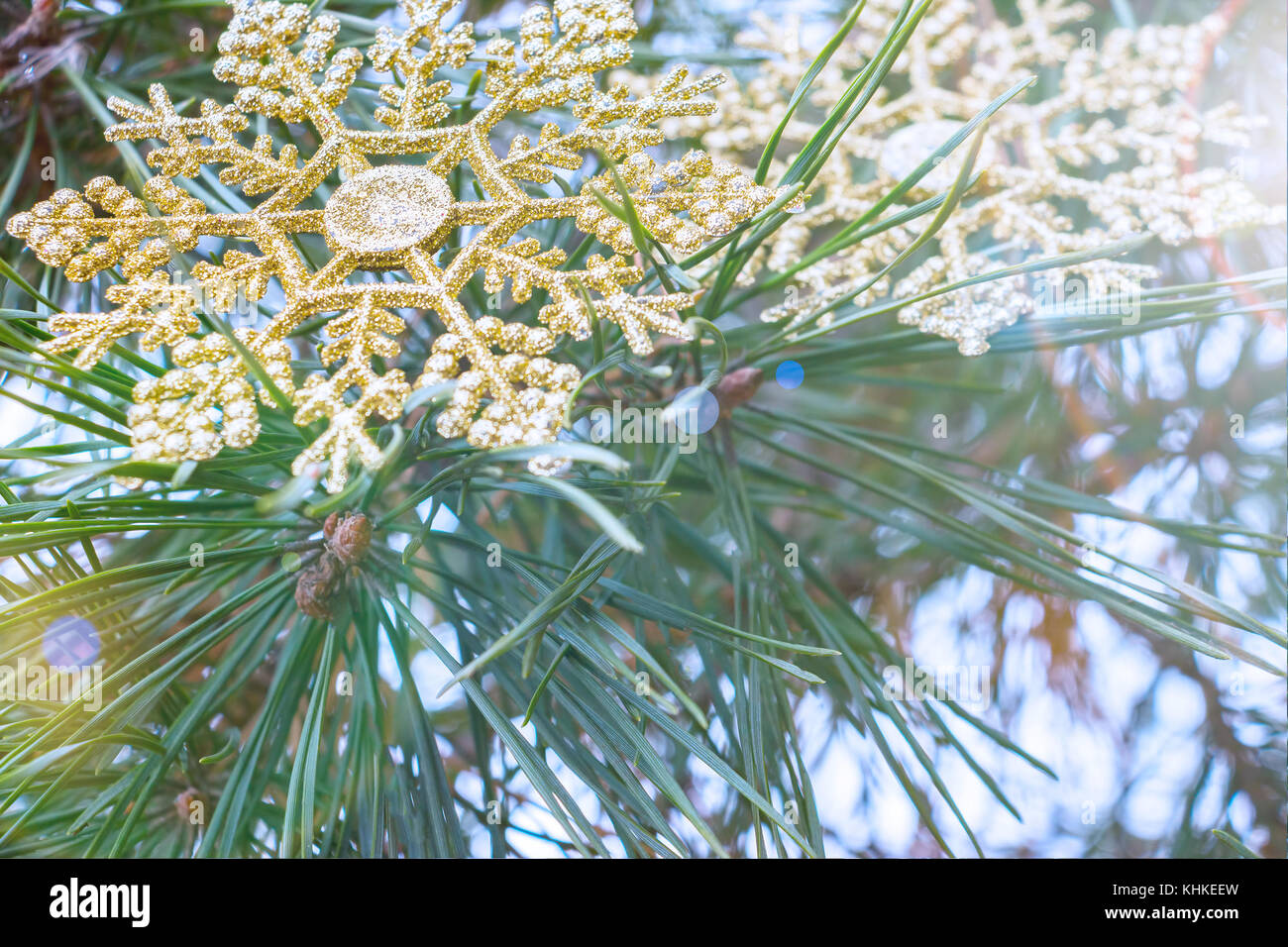 Artificial snowflake on the branches Stock Photo - Alamy