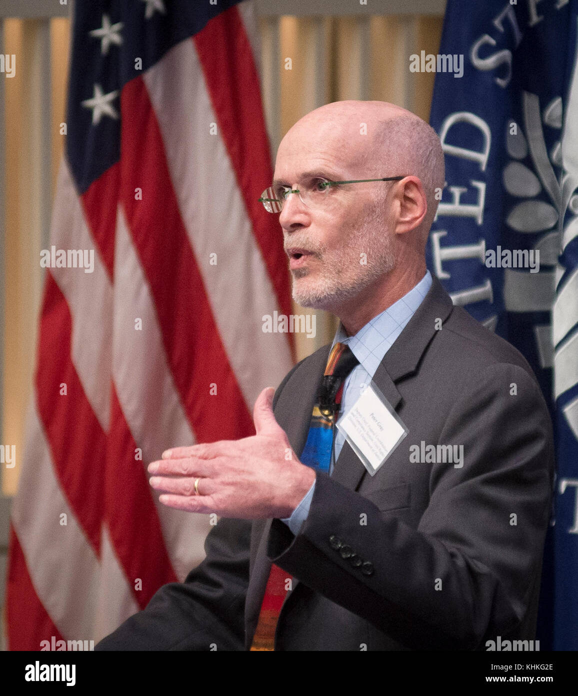 U.S. Department of Justice (DOJ) Deputy Chief Peter Gray, at podium, U ...