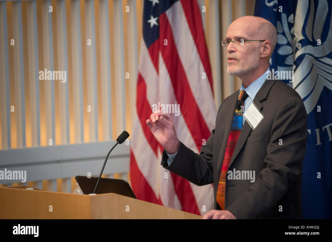 U.S. Department of Justice (DOJ) Deputy Chief Peter Gray, at podium, U ...