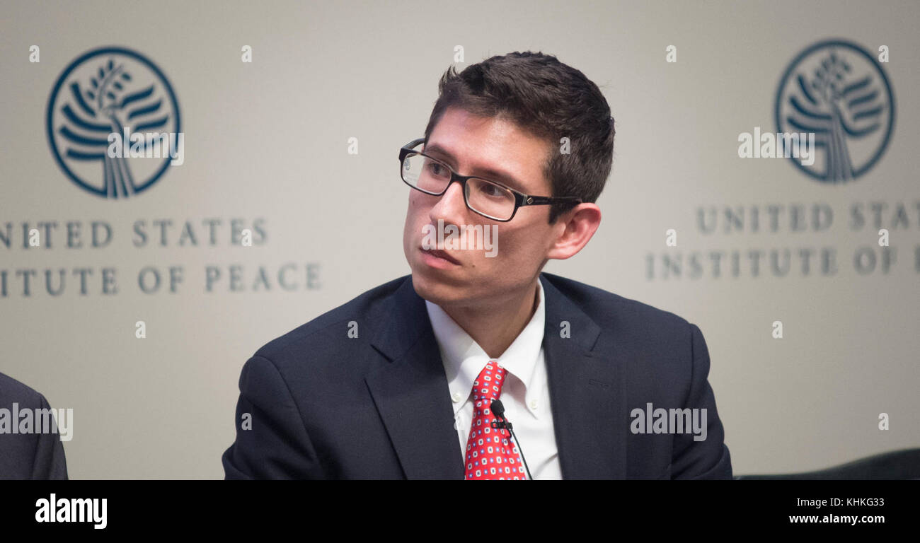 U.S. Department of Justice (DOJ) Deputy Chief Peter Gray, at podium, U ...