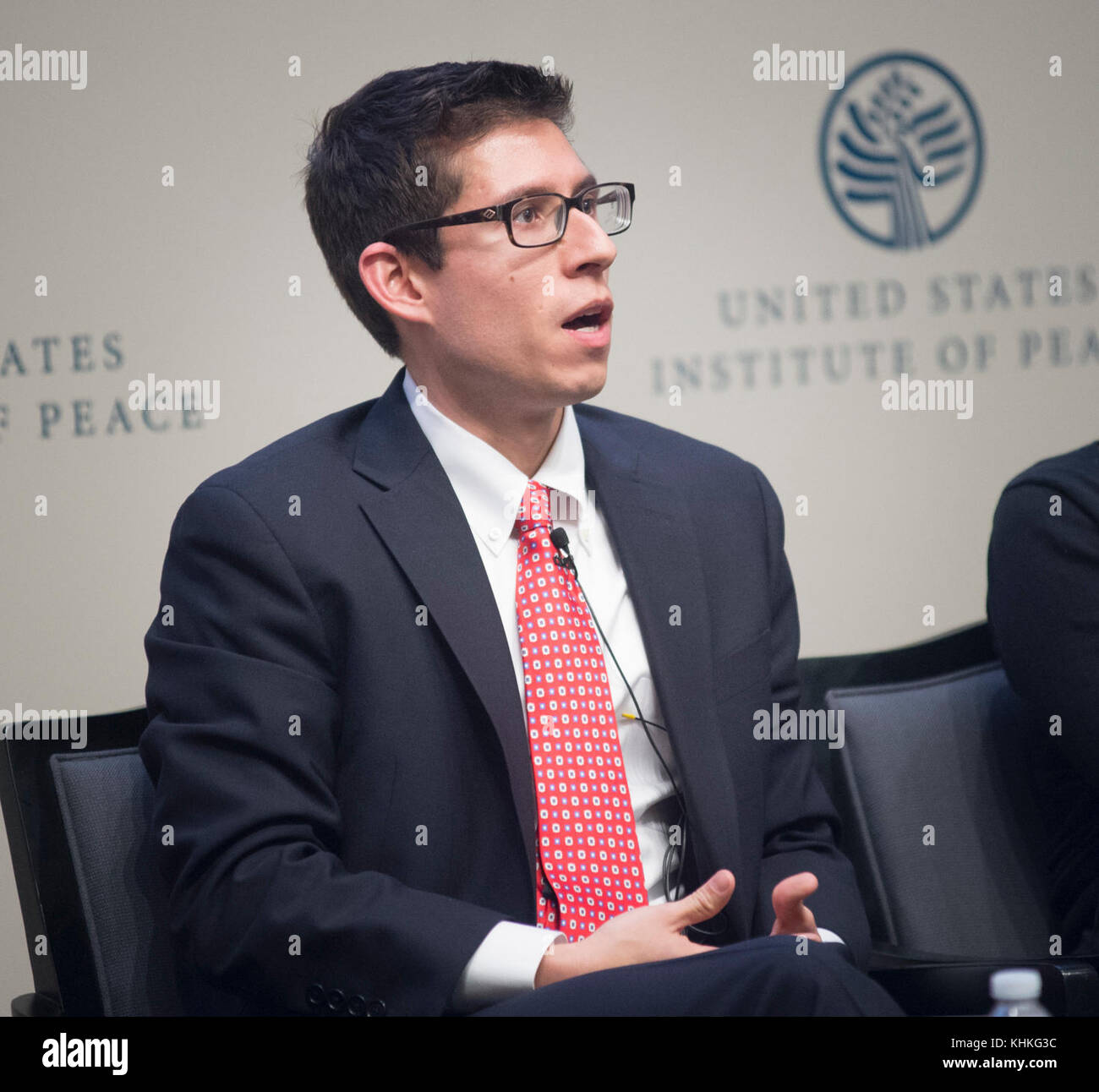 U.S. Department of Justice (DOJ) Deputy Chief Peter Gray, at podium, U ...