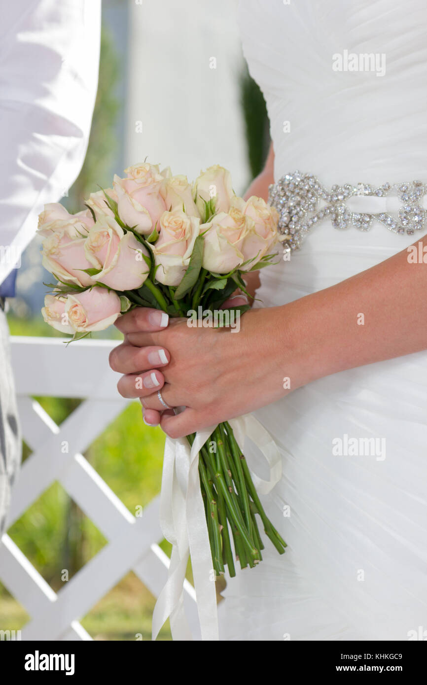 closeup of bride holding a bouquet of beautiful flowers Stock Photo - Alamy