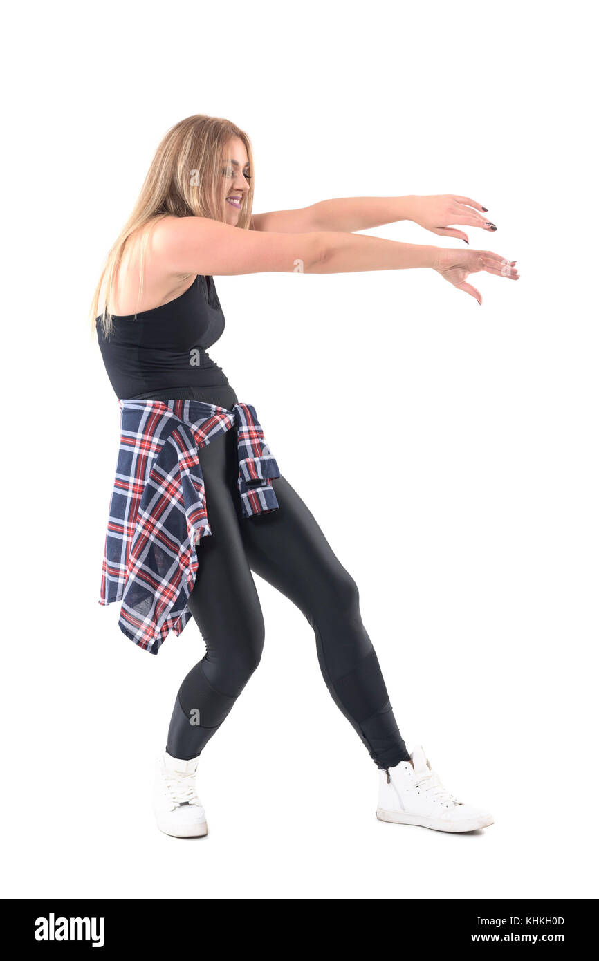 Side view of smiling happy flexible female modern dancer motion. Full ...