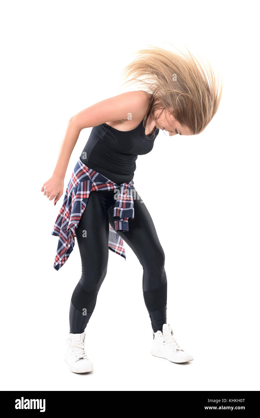 Passionate energetic modern female dancer shaking head with hair ...