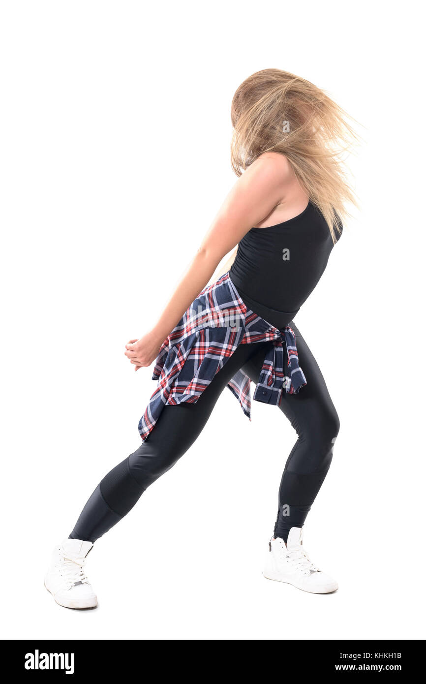 Profile view of modern jazz dancer raising head with flowing hair. Full ...
