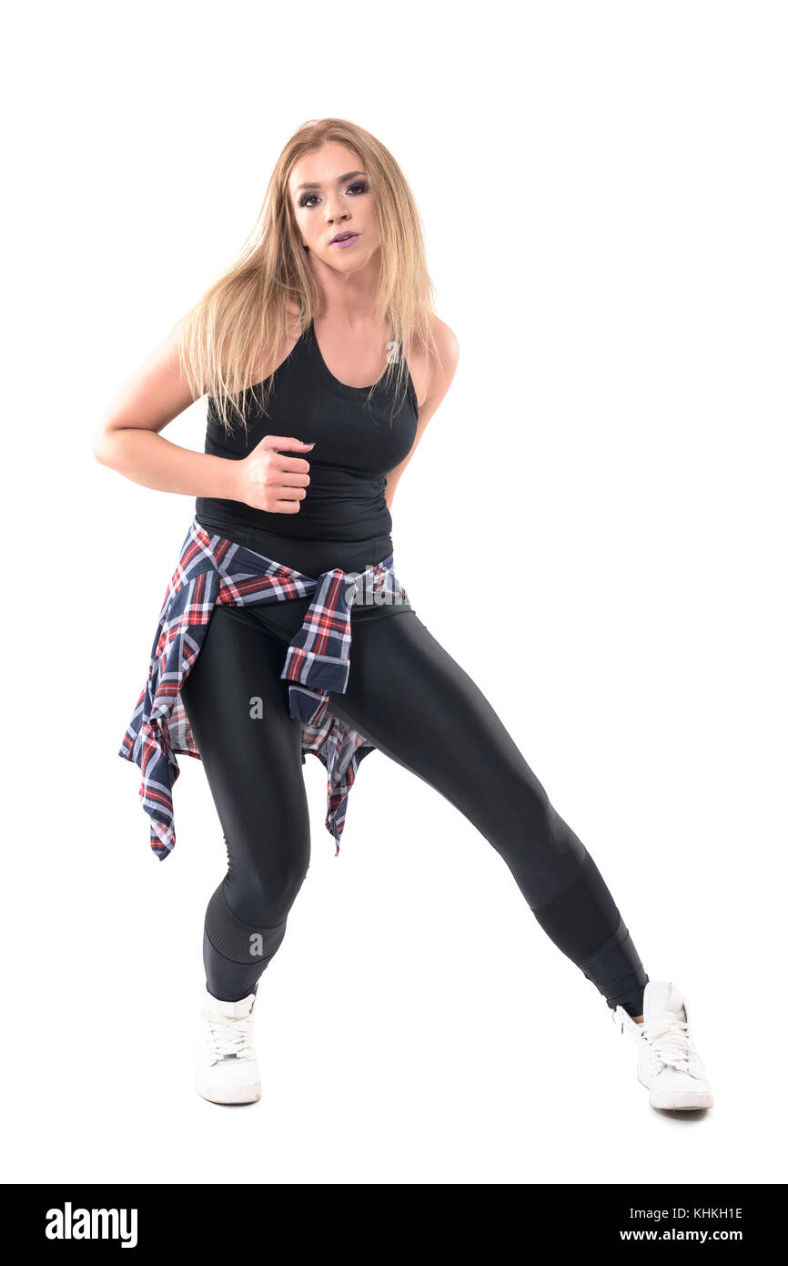 Front view of blonde jazz dance female dancer moving and looking at ...