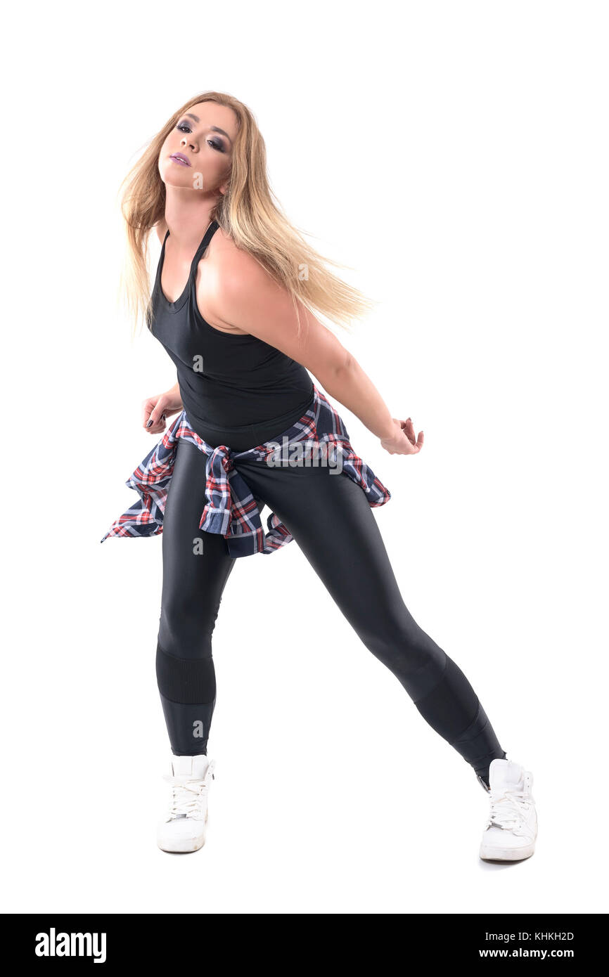 Jazz dance aerobics instructor dancing and moving bent forward. Full ...