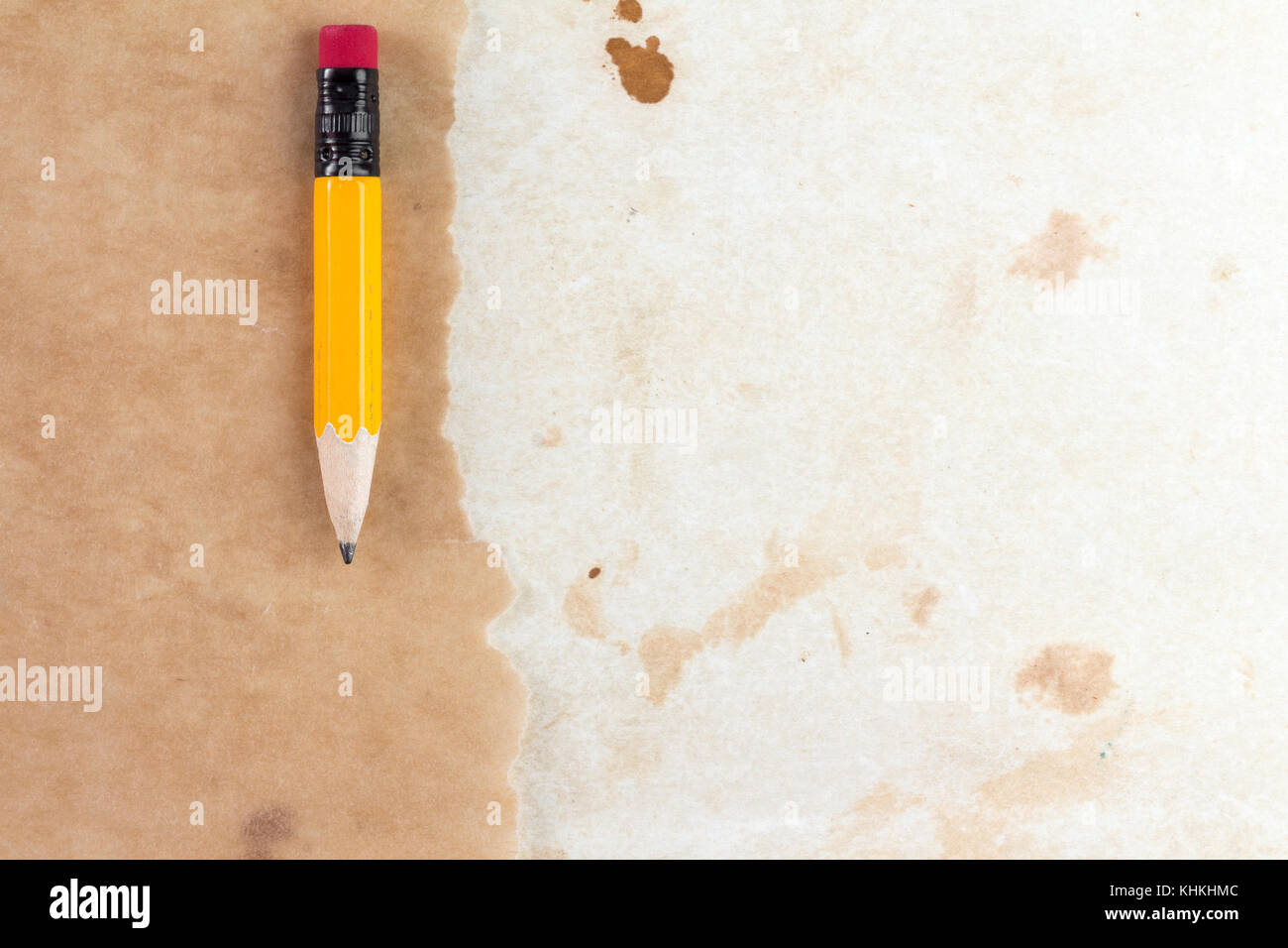 Piece of a old paper with a short pencil Stock Photo - Alamy