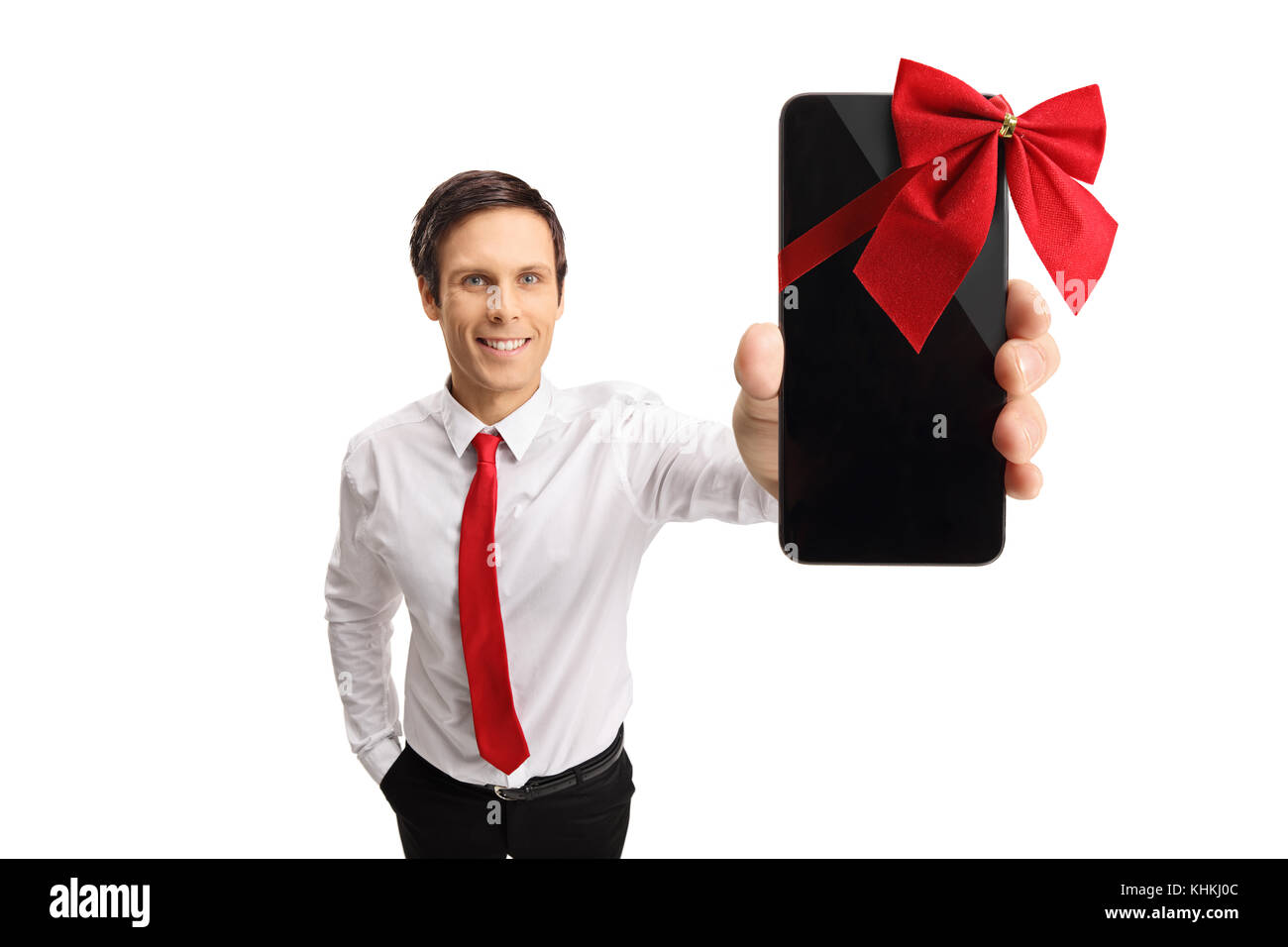 Formally dressed guy showing a phone wrapped with a red ribbon as a ...