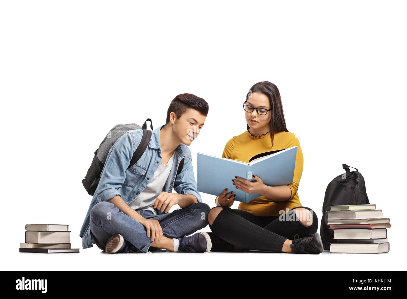 Two teenage students sitting on the floor and studying isolated on ...
