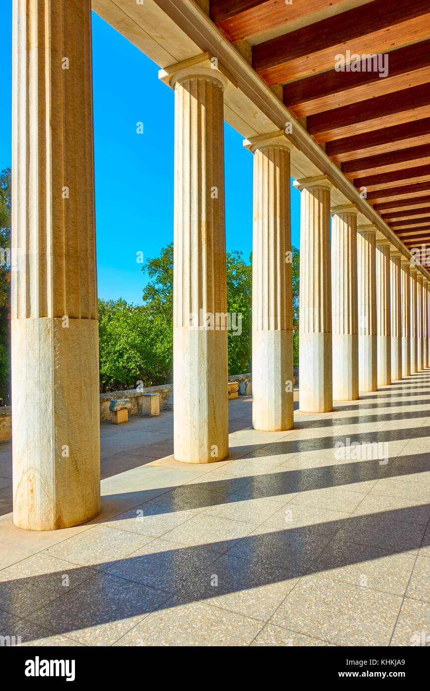 Perspective of colonnade of marble classical columns, Athens, Greece ...