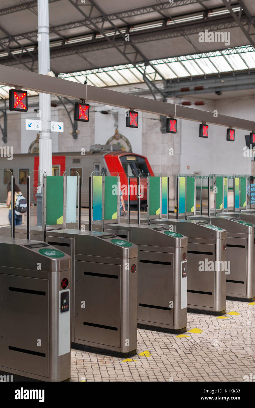 Electronic turnstiles in train station terminal Stock Photo - Alamy