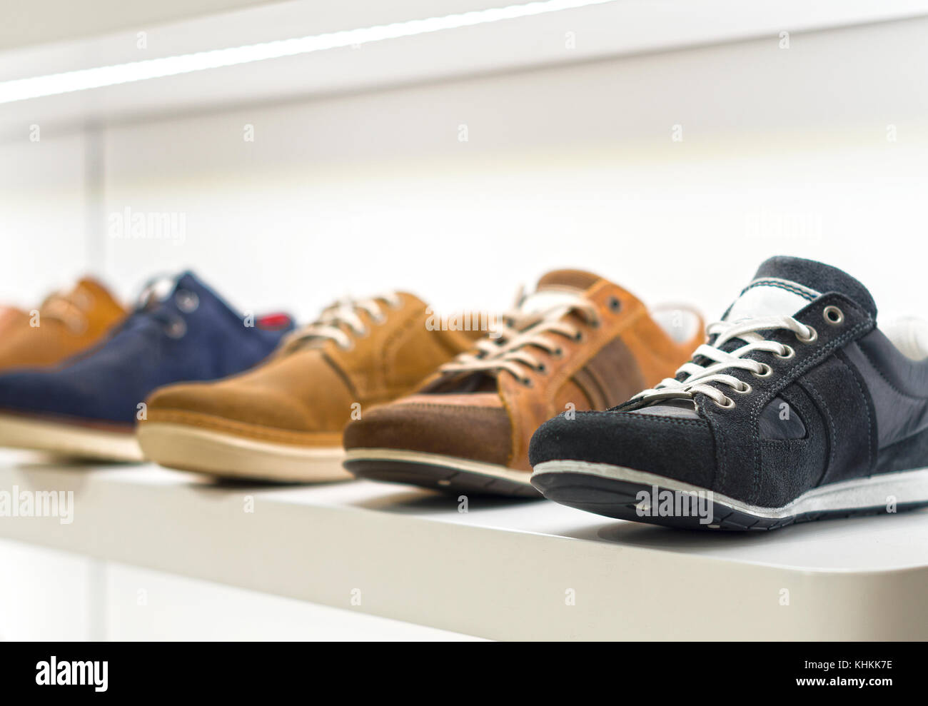 Collection of men's shoes in the store Stock Photo - Alamy