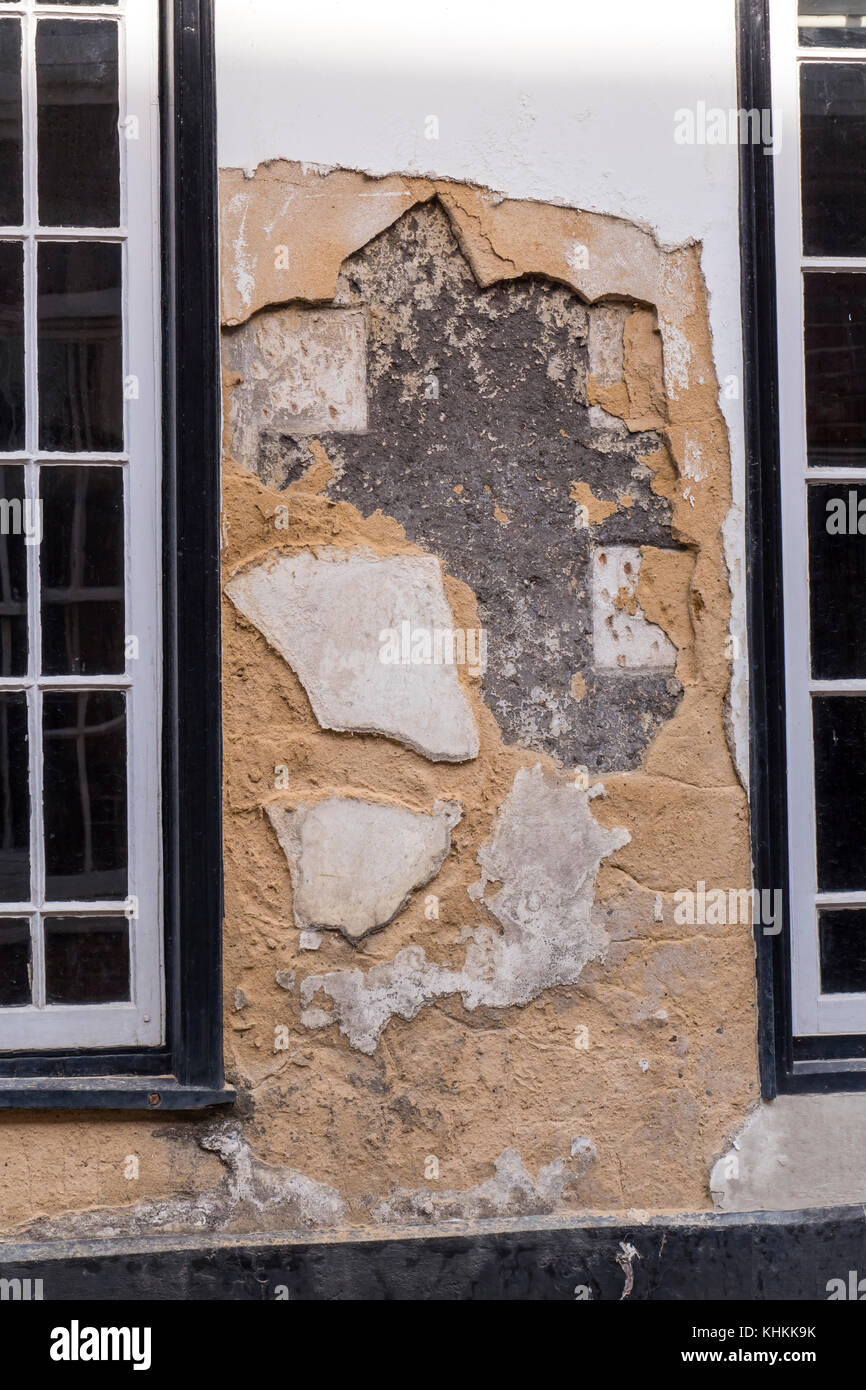 Outside wall with damaged render Little Walsingham Norfolk England ...