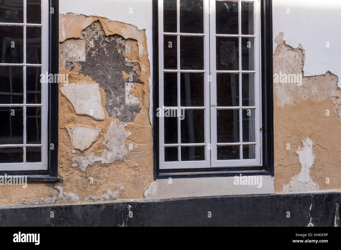 Outside wall with damaged render Little Walsingham Norfolk England ...