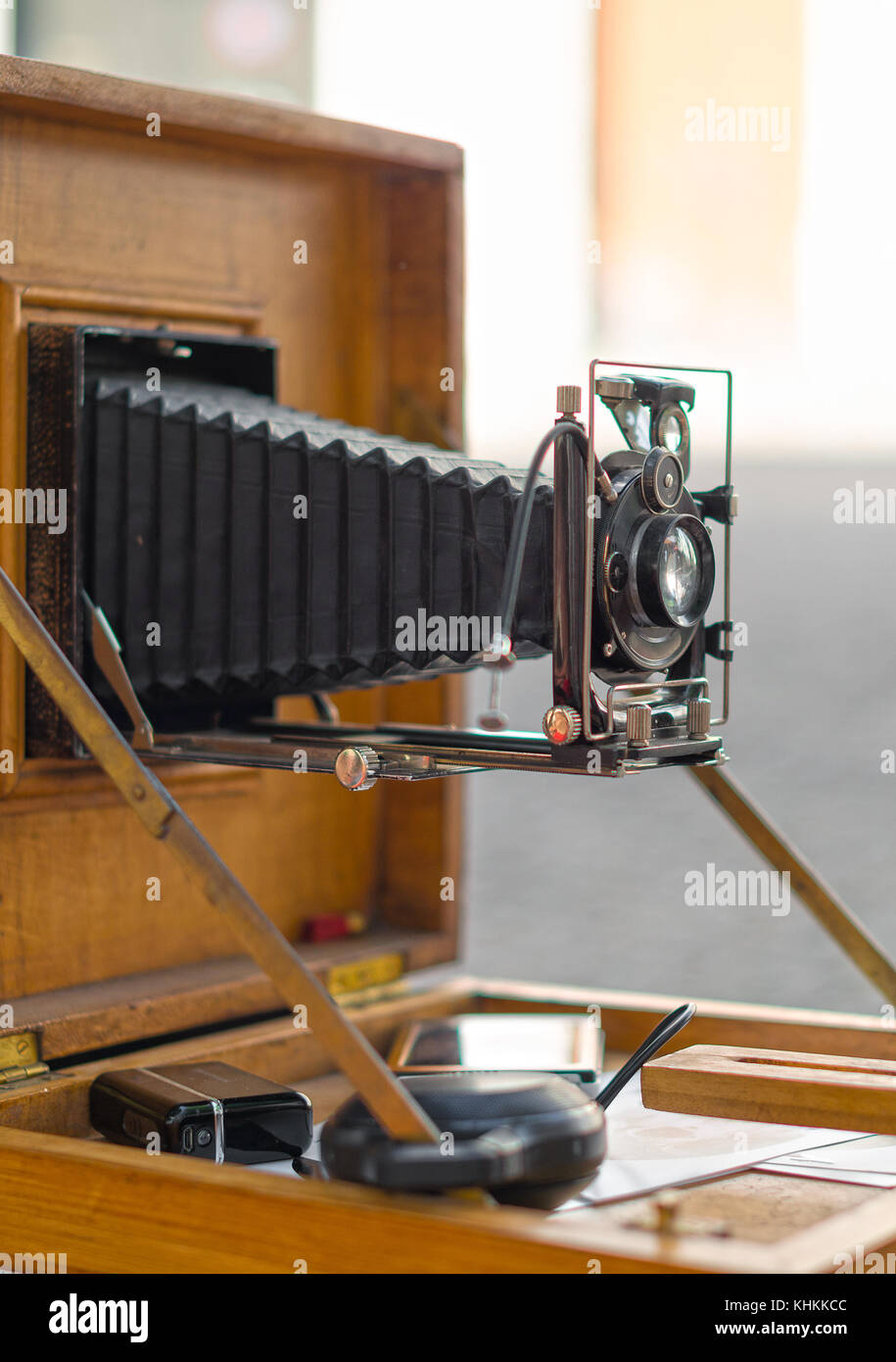Old vintage folding camera on the street Stock Photo - Alamy