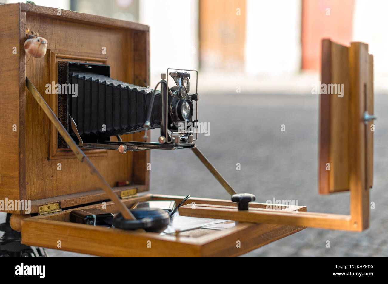 Old vintage folding camera on the street Stock Photo - Alamy