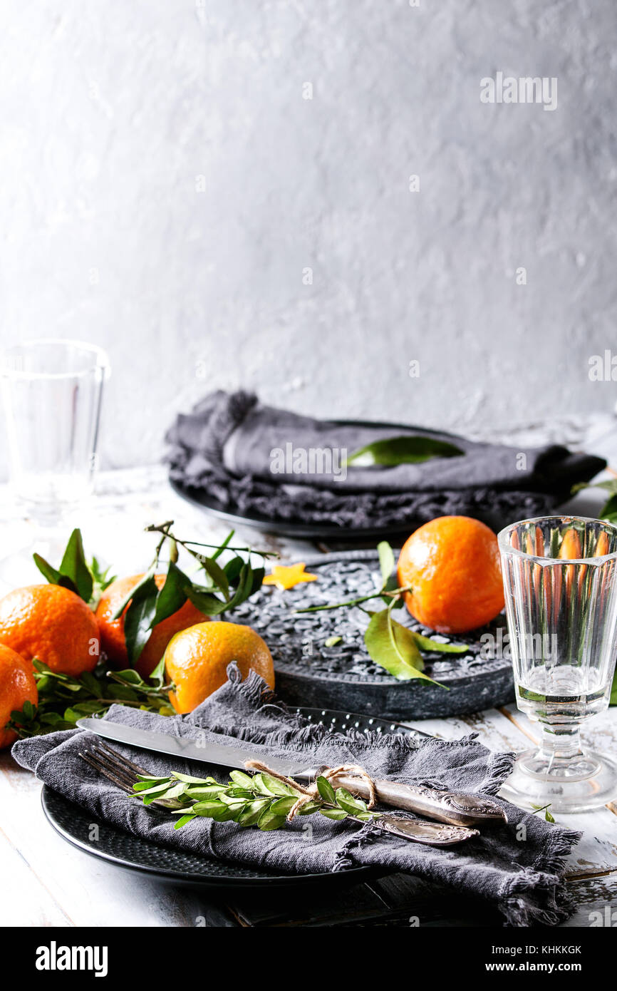 Christmas table decorations with clementines Stock Photo - Alamy