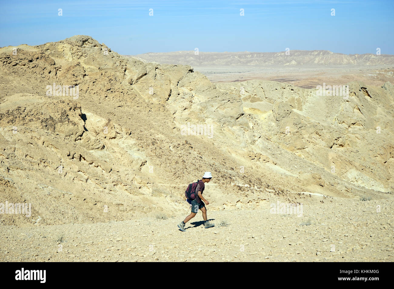 Backpacker walk in crater Ramon in Negev desert, Israel Stock Photo - Alamy