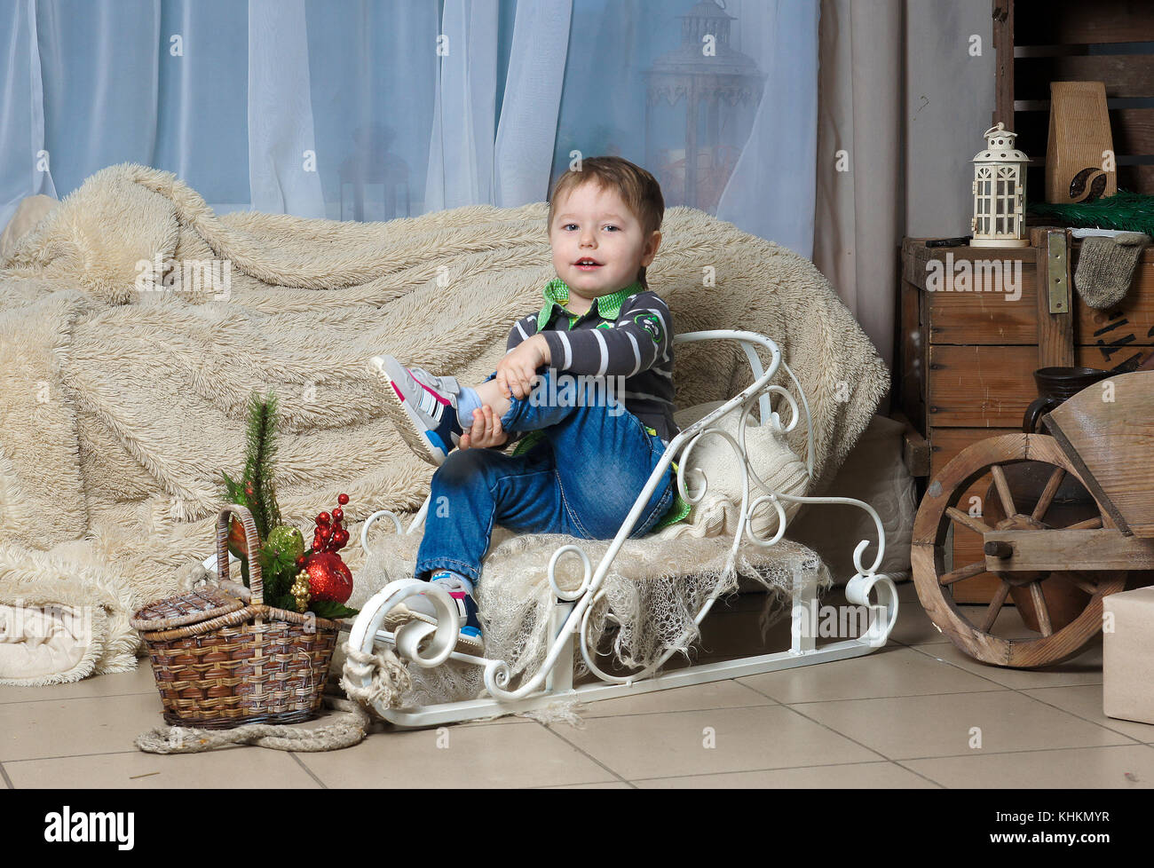 Little boy sitting on a sledge.Isolated portrait Stock Photo - Alamy