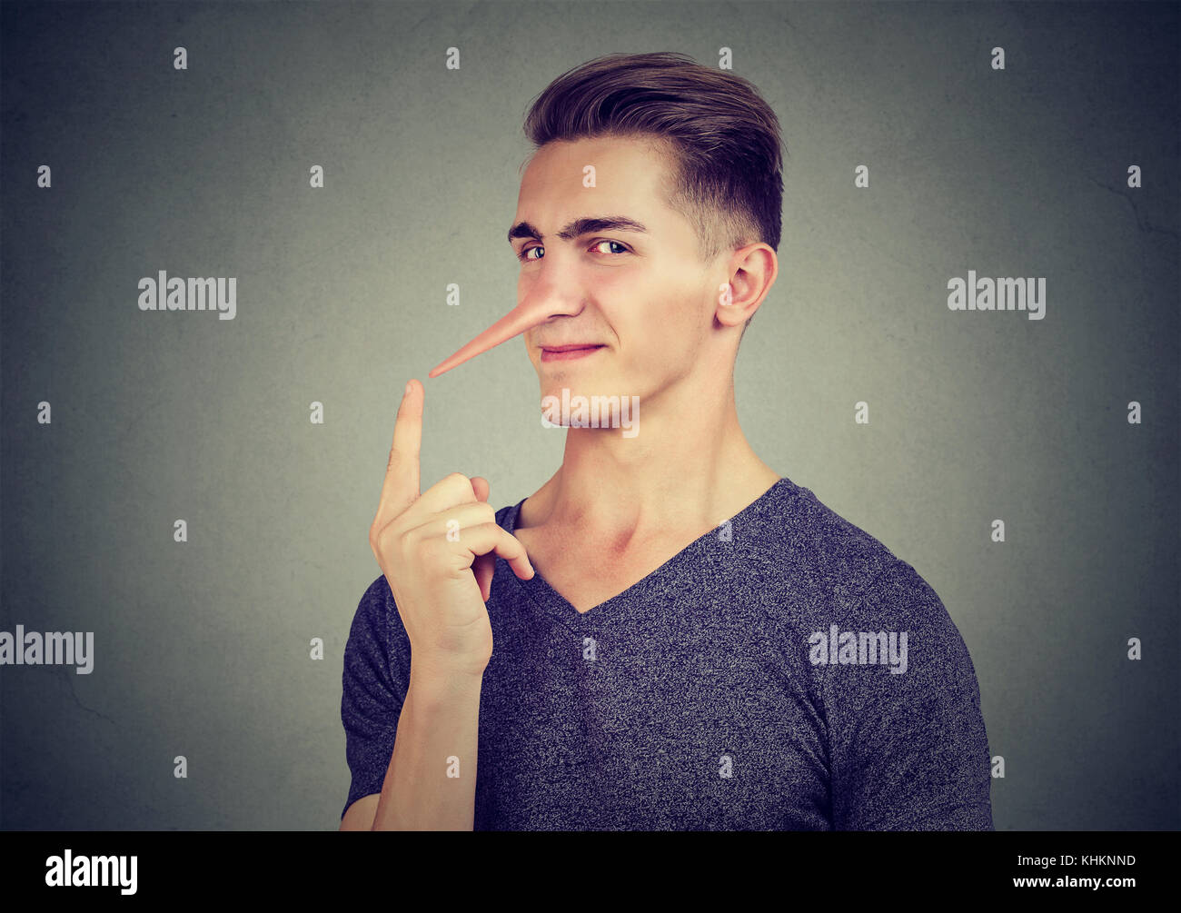 Man with long nose isolated on gray background. Liar concept. Human ...