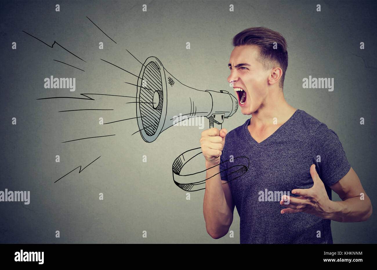 Young man screaming into a megaphone making an announcement Stock Photo ...