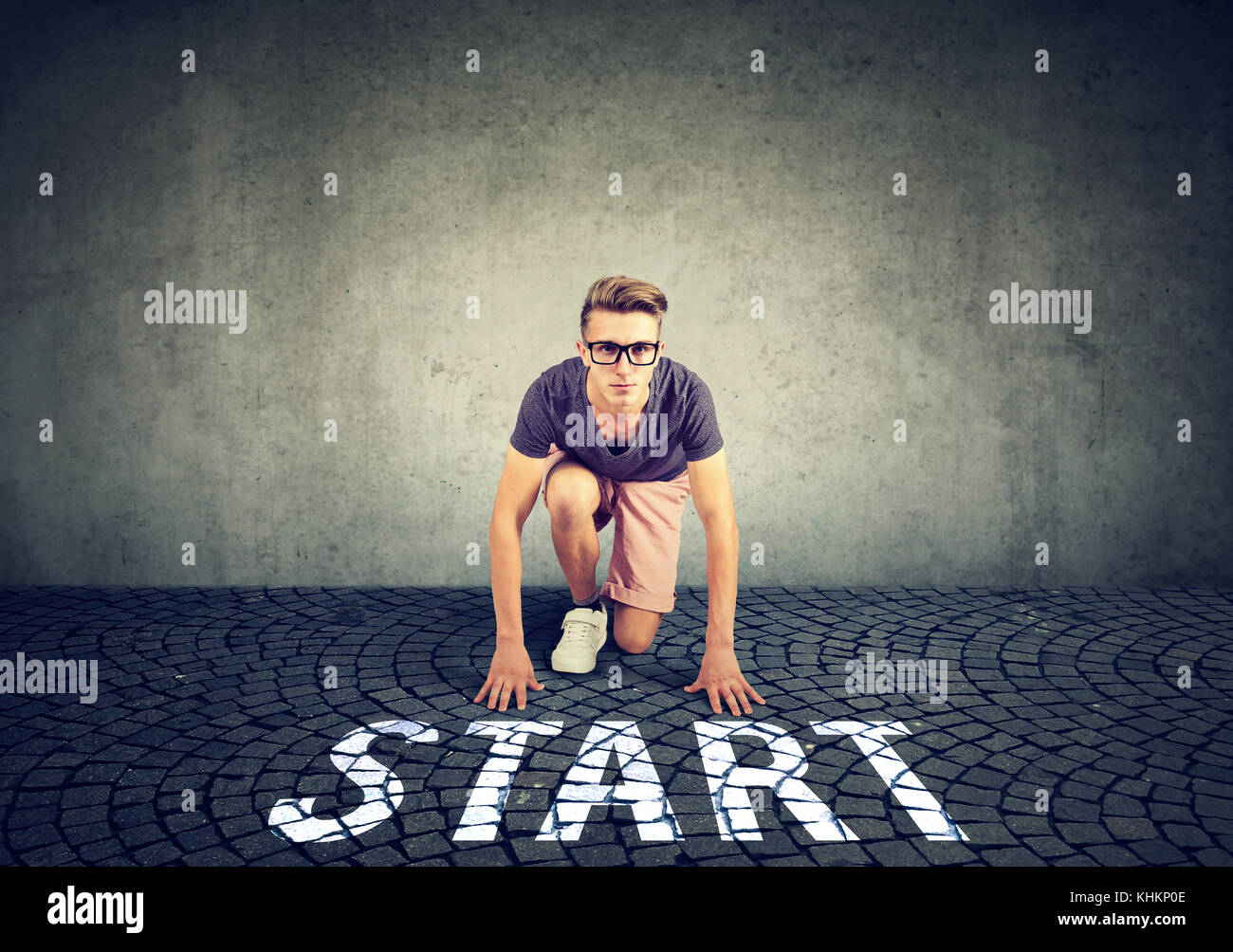 young man in the starting position Stock Photo - Alamy