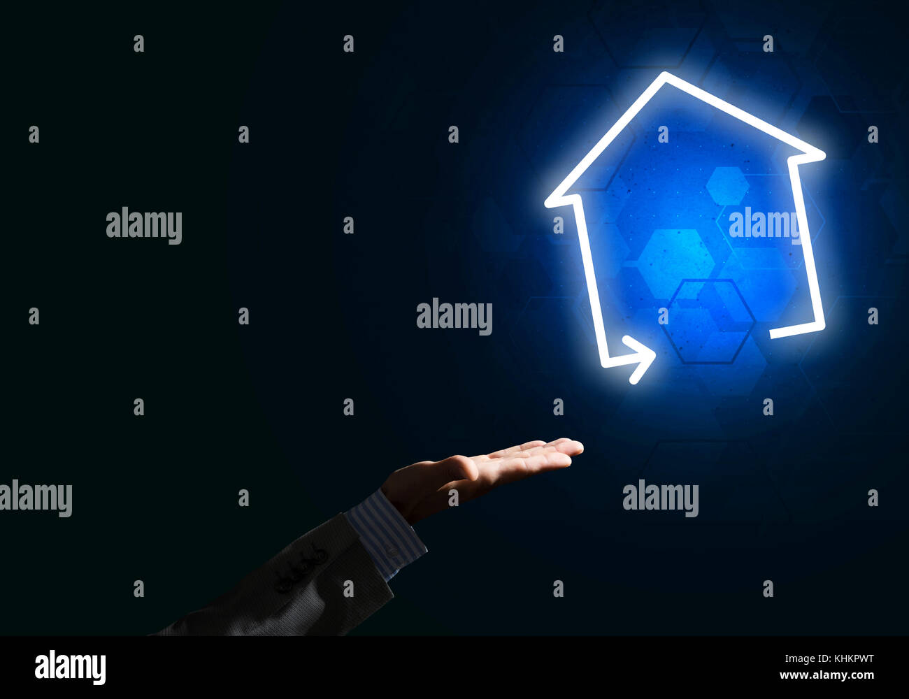 Conceptual image with hand pointing at house or main page icon on dark ...