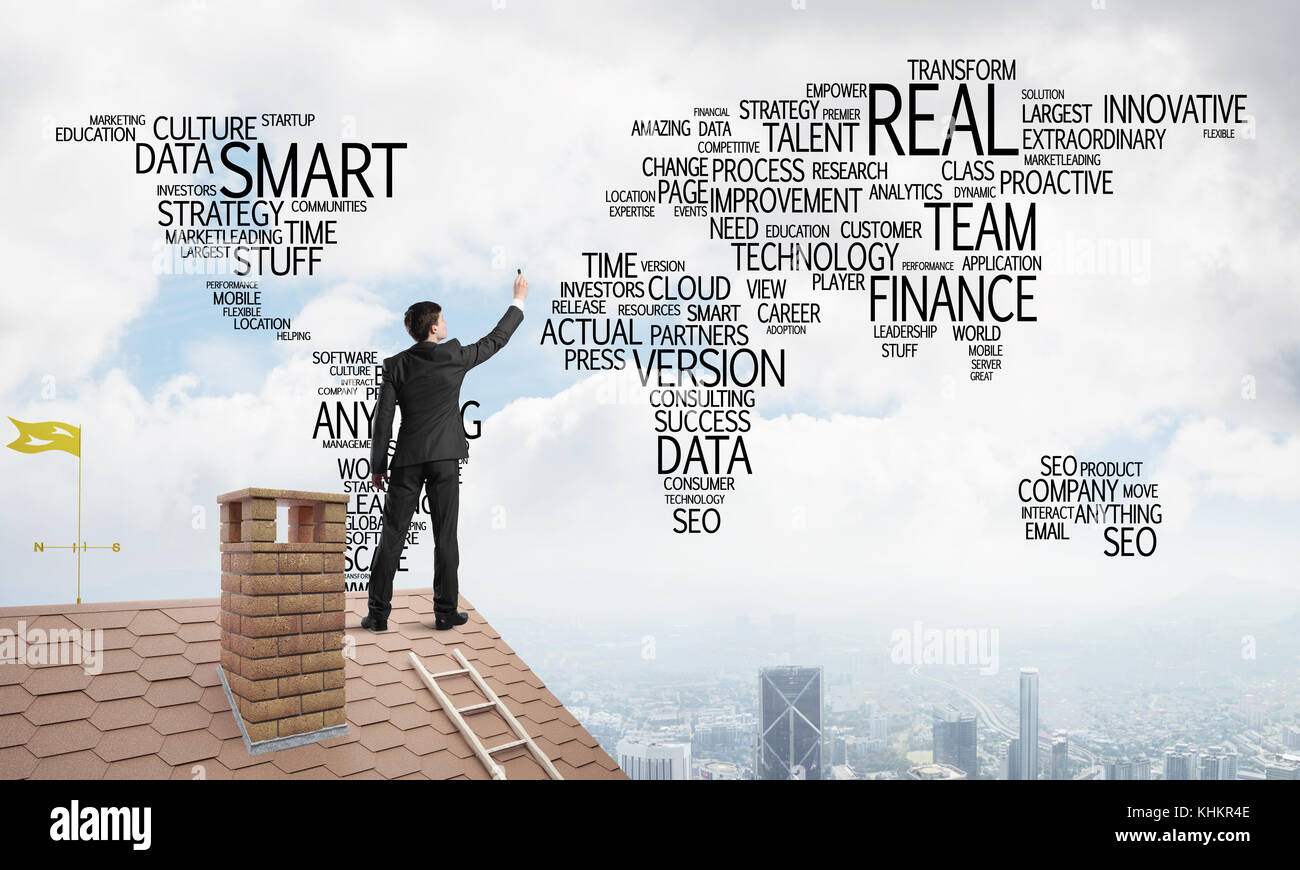 Businessman on brick roof draw world map as concept of globalization ...