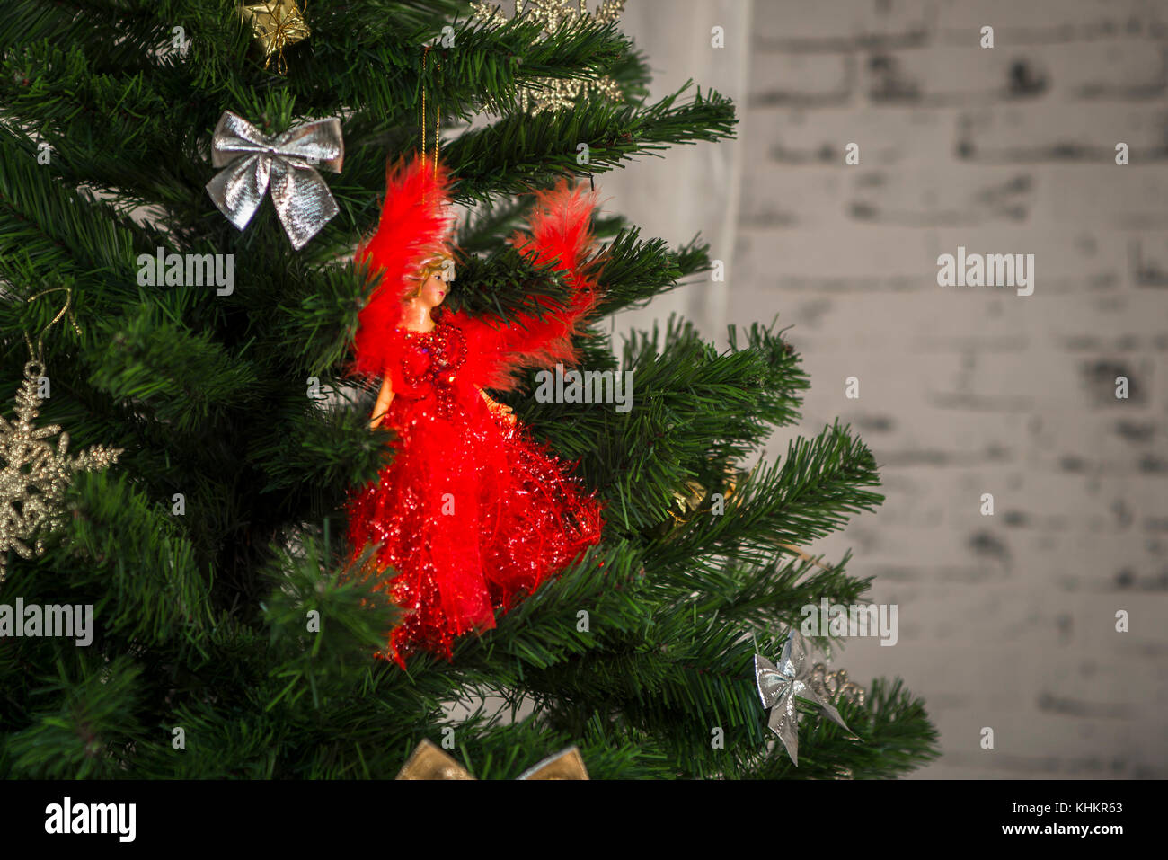Christmas tree decorated with a red toy Stock Photo - Alamy