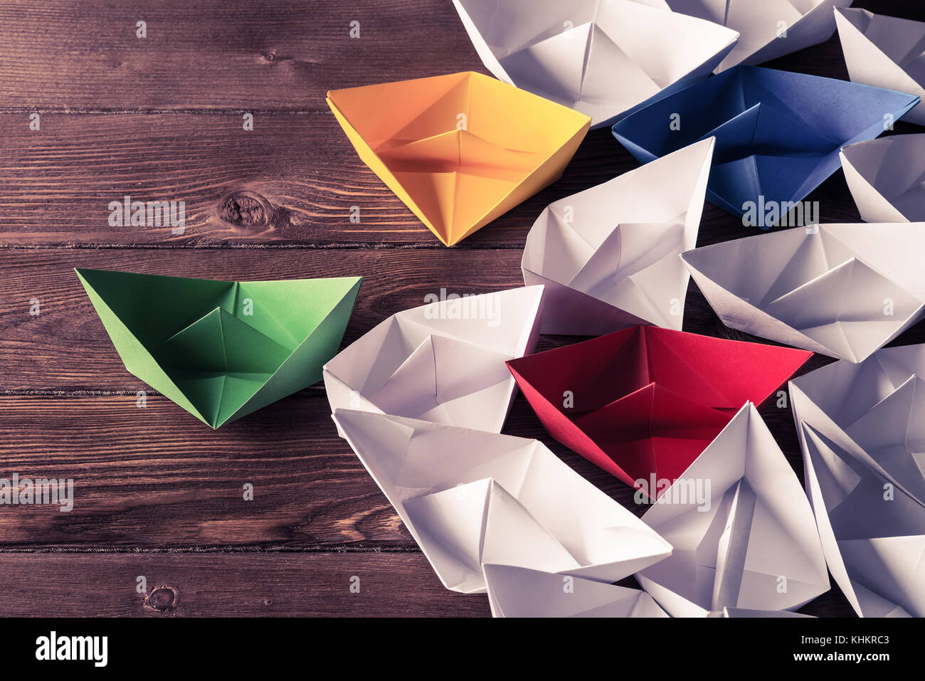 Business leadership concept with white and color paper boats on Stock ...